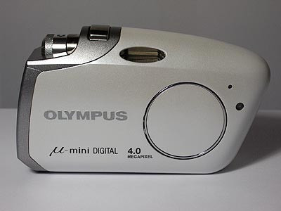 Olympus Mini camera digital cu husa, incarcator acumulator 220V si auto ...