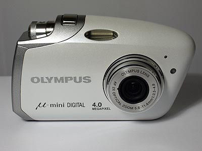 Olympus Mini camera digital cu husa, incarcator acumulator 220V si auto ...